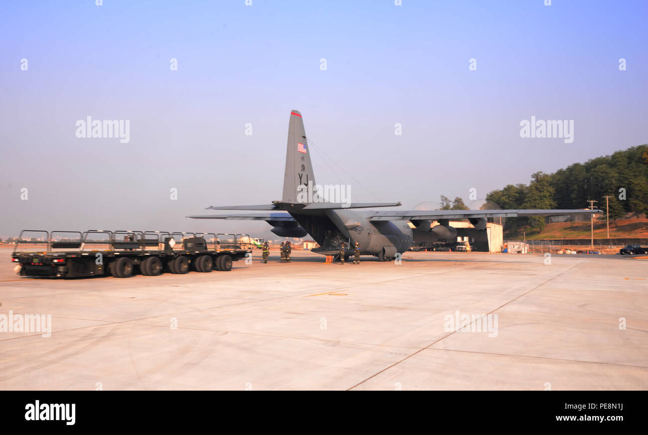 Airmen assigned to the 731st Air Mobility Squadron prepare to perform a ...