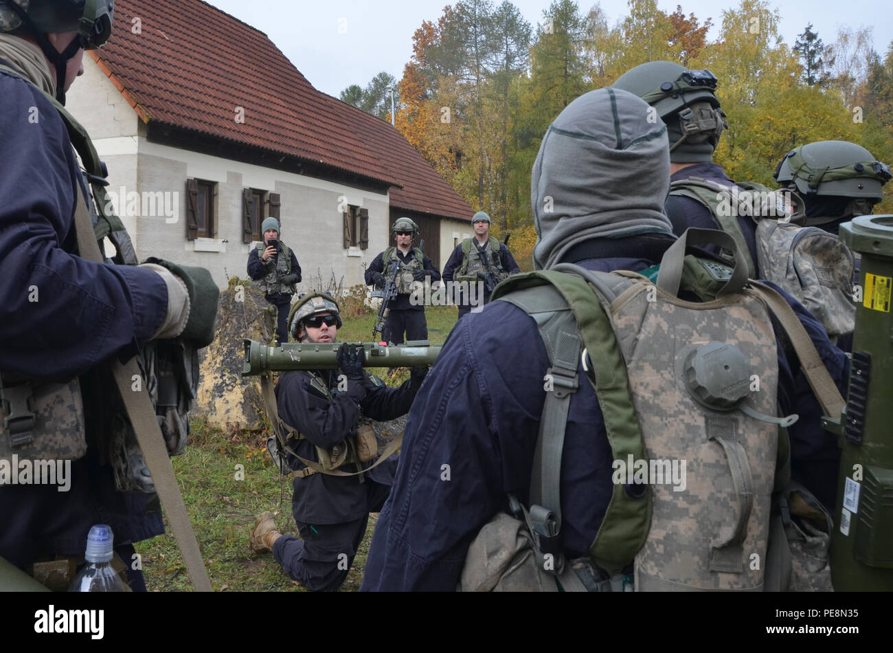 U.S. Army Sgt. Kristoffer West, center, of Foxtrot Troop, 2nd Squadron ...