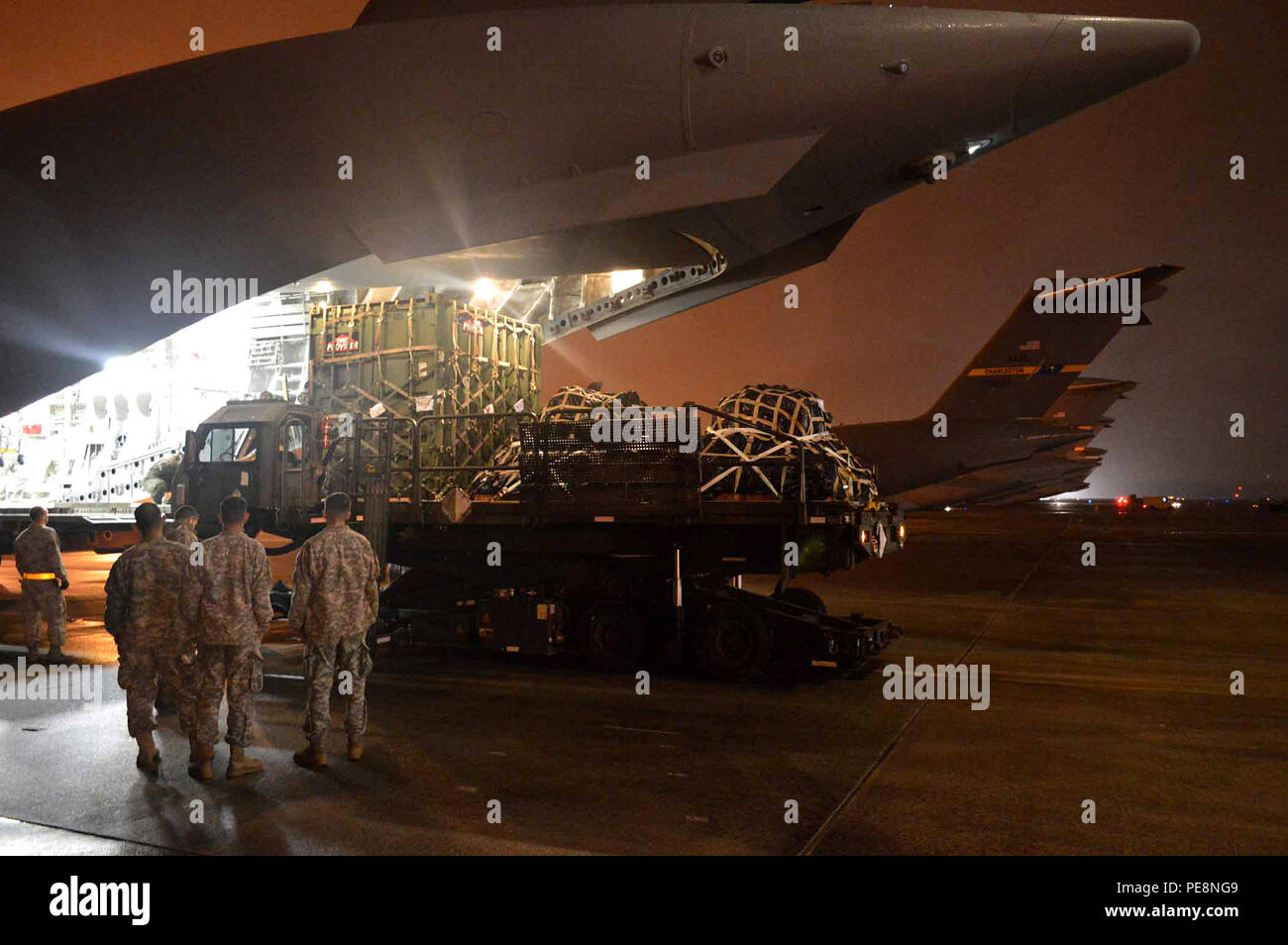 U.S. Army Soldiers assigned to 82nd Airborne Division watch the loading ...