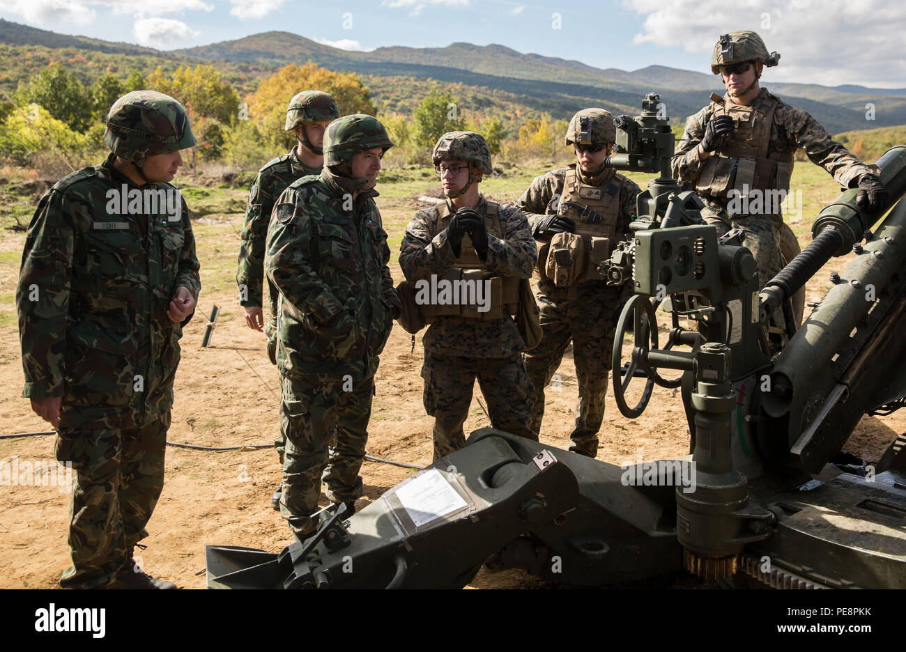 Marines with the Combined Arms Company demonstrate the M-777 Howitzer ...