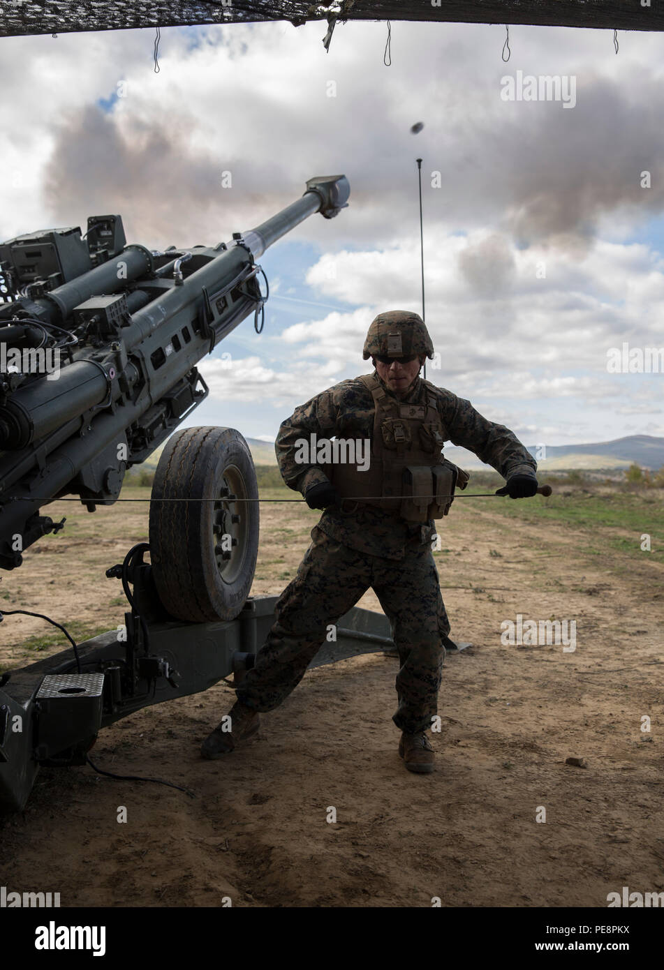 Marines with the Combined Arms Company demonstrate the M-777 Howitzer ...