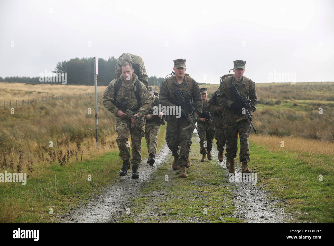 U.S. Marine Lance Cpl. Jason Shillingburg, center, and Lance Cpl. Mason ...