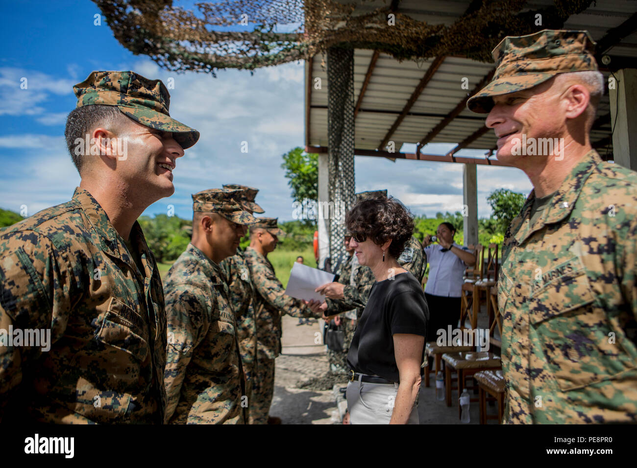 U.S. Marine Corps Lt. Col. David T. Hudak, right, commanding officer ...