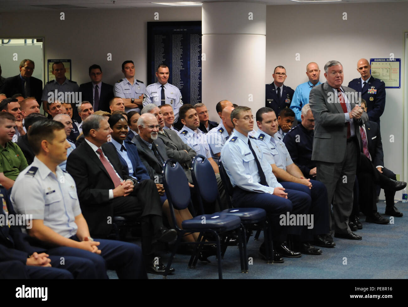 An attendee asks a question during the speaking engagement with retired ...