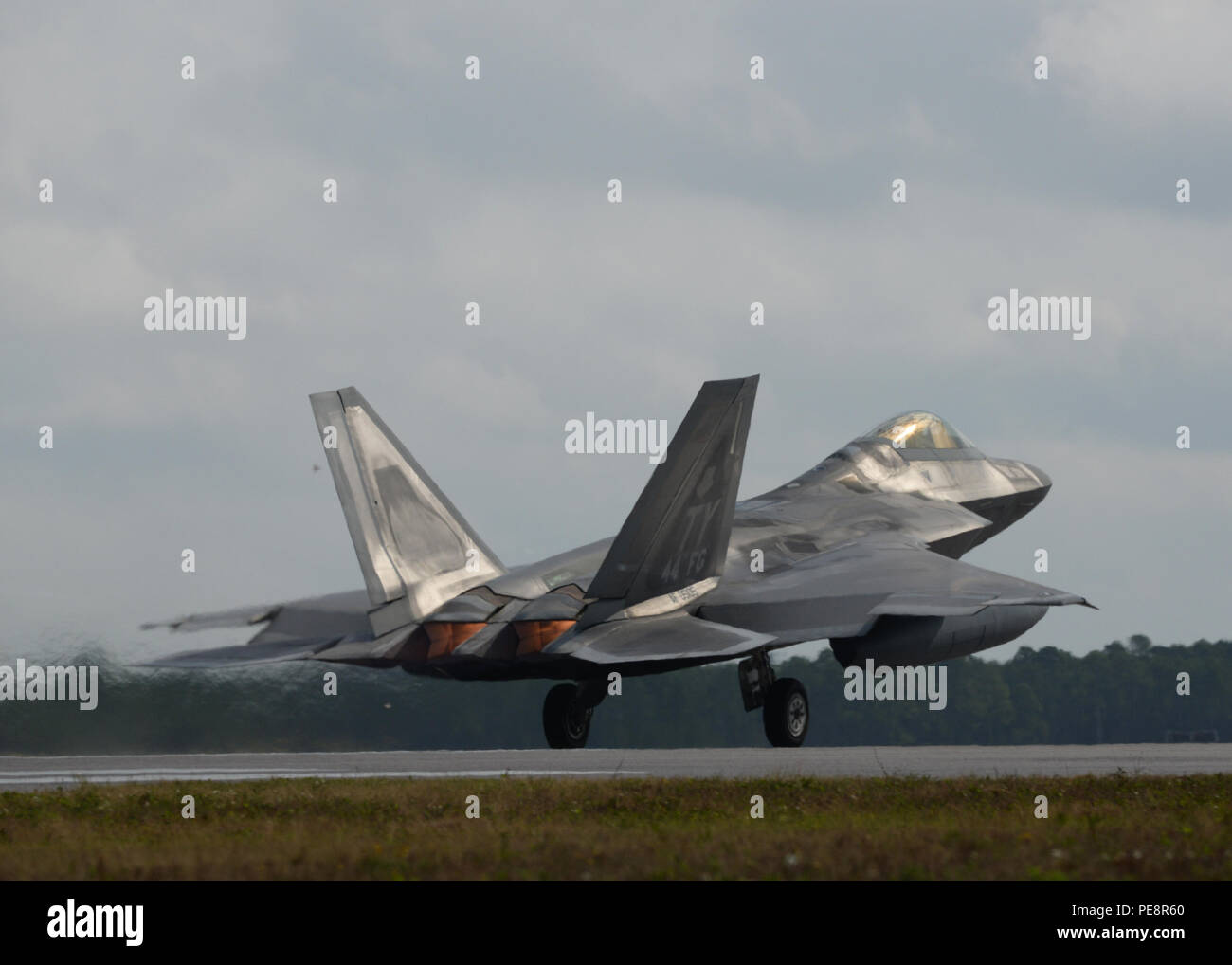 An F-22 Raptor accelerates using afterburners at Tyndall Air Force Base ...