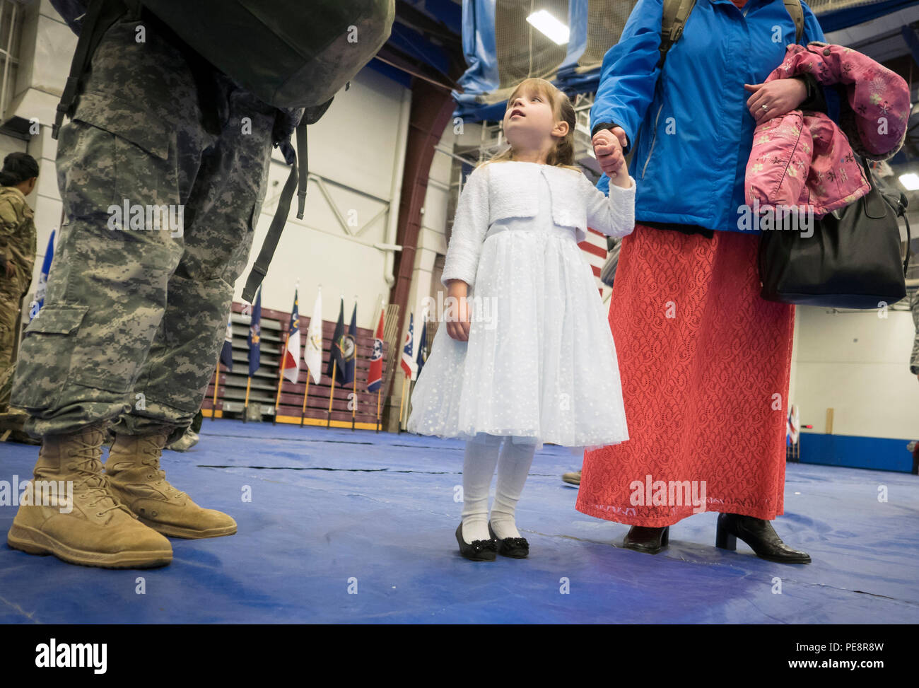 Autumn Rodden, 4, looks up at her father, Army Staff Sgt. David Rodden ...
