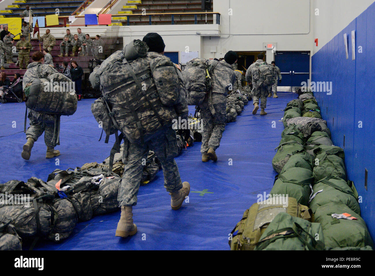 Soldiers unload the bags of service members assigned to the 98th ...