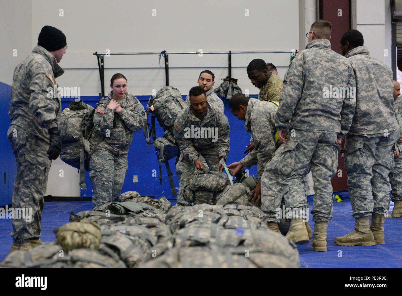 Soldiers unload the bags of service members assigned to the 98th ...