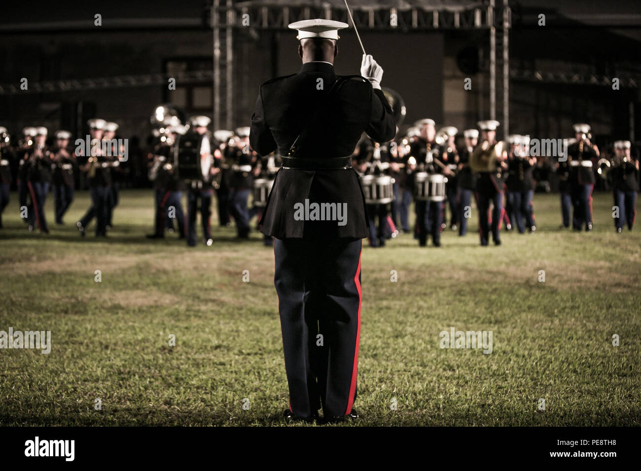 Warrant Officer DeMarius Jackson conducts the band during a performance ...