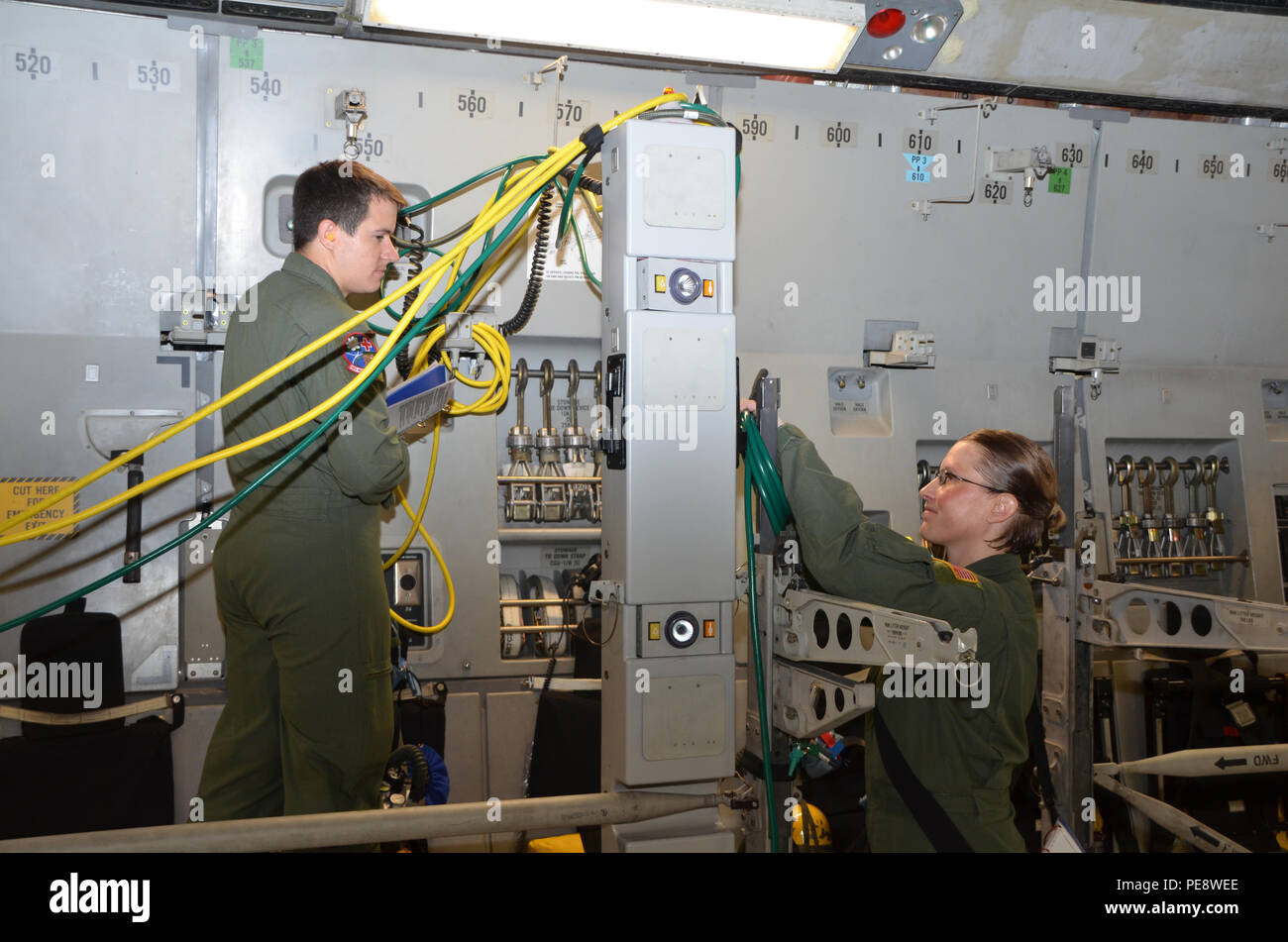 Senior Airman Jarret Lee (left) and Staff Sgt. Shannon Lunn, members of ...