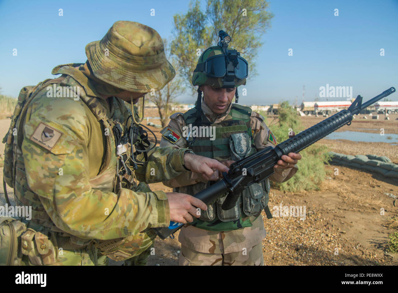 An Australian soldier assigned to Task Group Taji instructs an Iraqi ...