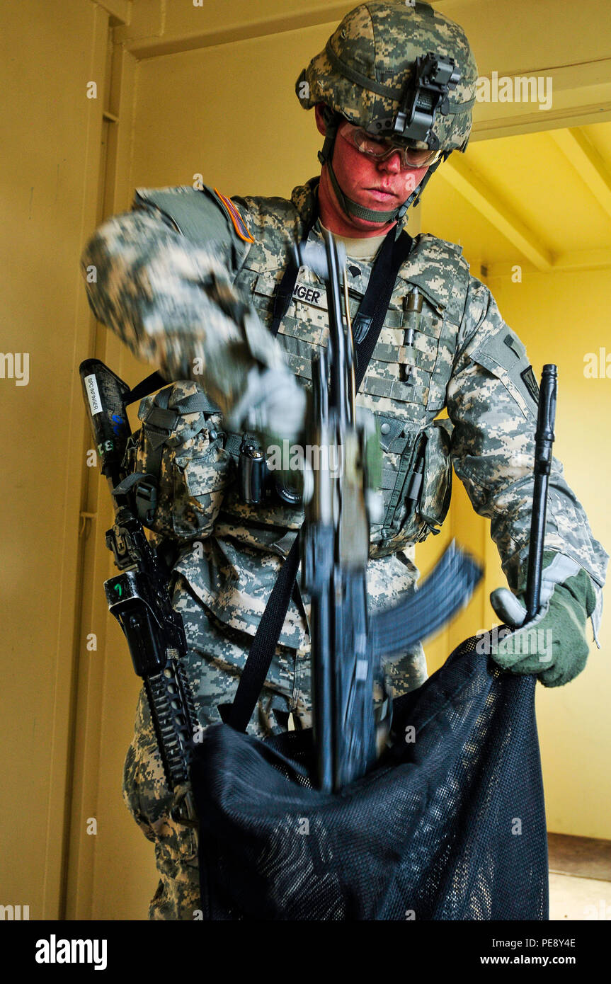 Spc. Layne Infinger, a human intelligence collector assigned to Company ...
