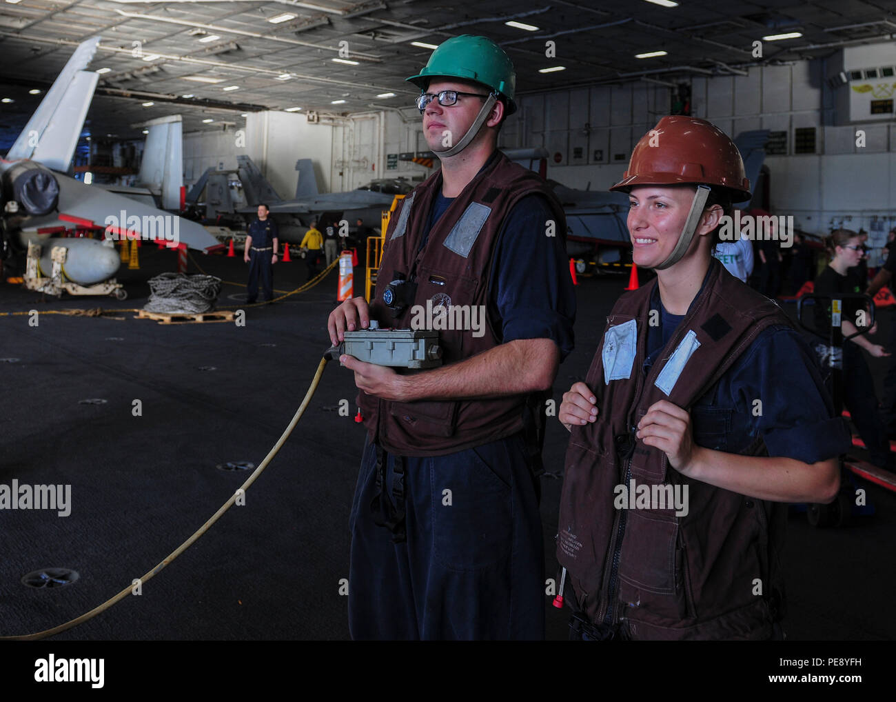 Sailors aboard the aircraft carrier USS Theodore Roosevelt (CVN 71 ...