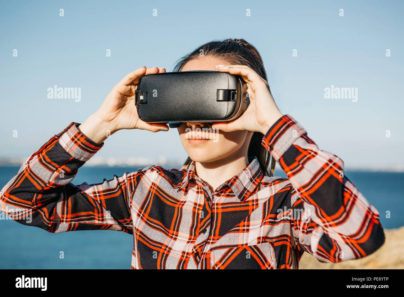 The girl in glasses of a virtual reality. Modern technology in everyday ...