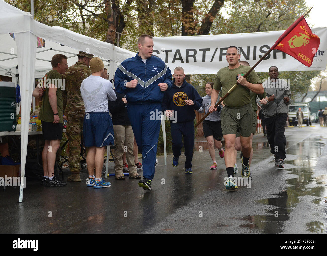 U.S. Marines carry the guidon during the First to Fight 240 Relay at ...