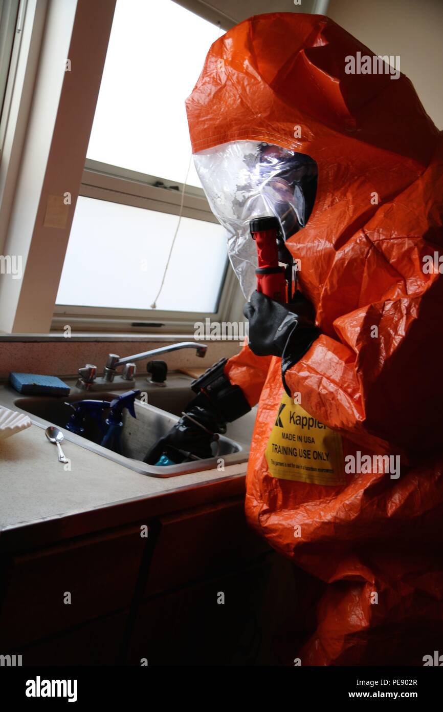 Staff Sgt. Jason Haggard conducts chemical tests on spores inside an ...