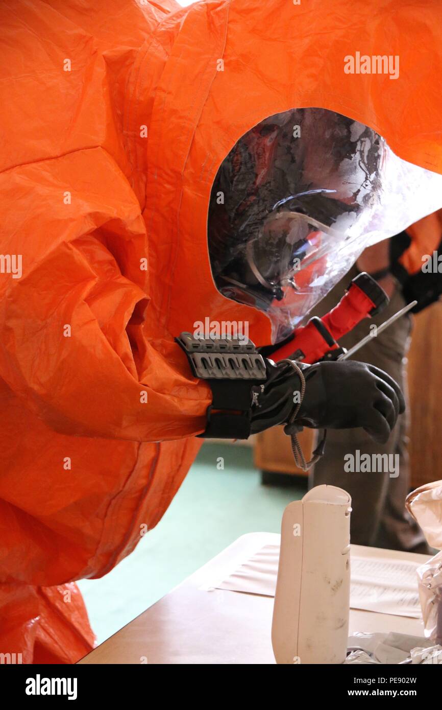 Staff Sgt. Jason Haggard conducts chemical tests on spores inside an ...