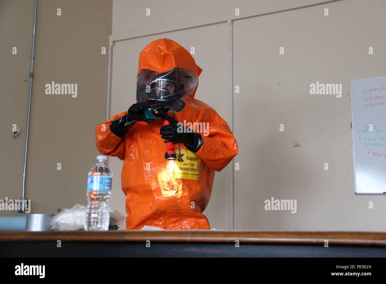 Staff Sgt. Jason Haggard conducts chemical tests on spores inside an ...