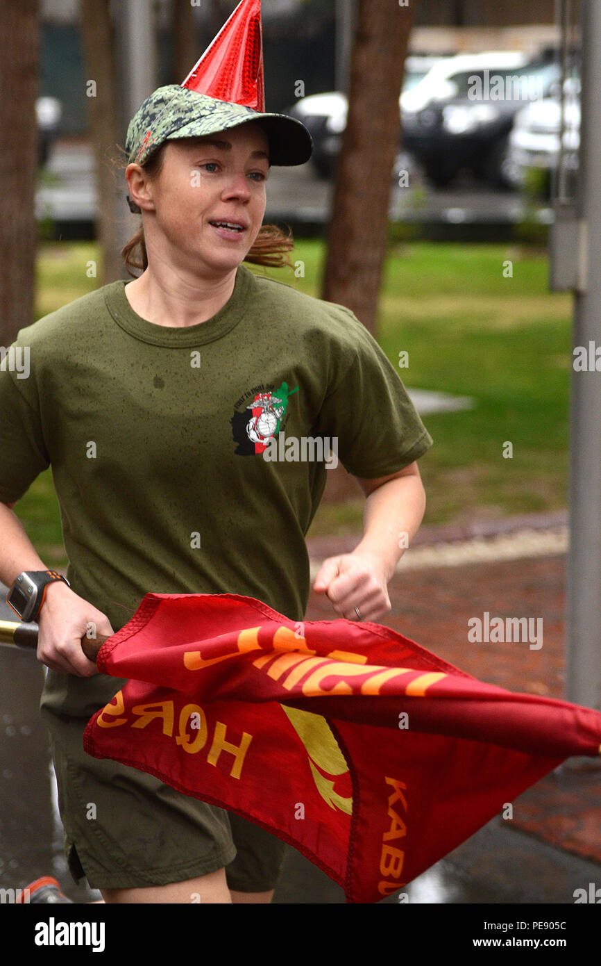 U.S. Marine Maj. Michelle Macandar carries the guidon during the First ...
