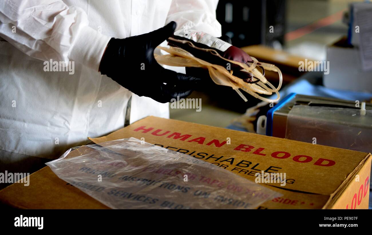 A U.S. Army Soldier prepares blood for processing and shipment during ...