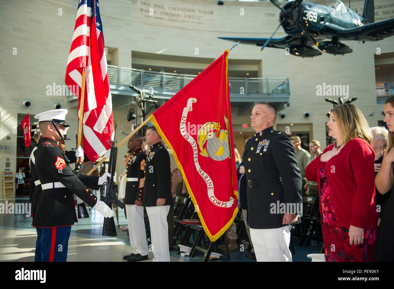 The retiring party and guests stand at attention for the National ...