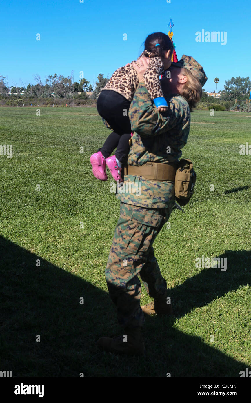 Master Gunnery Sgt. Diane Sharpe greets her child after her retirement ...