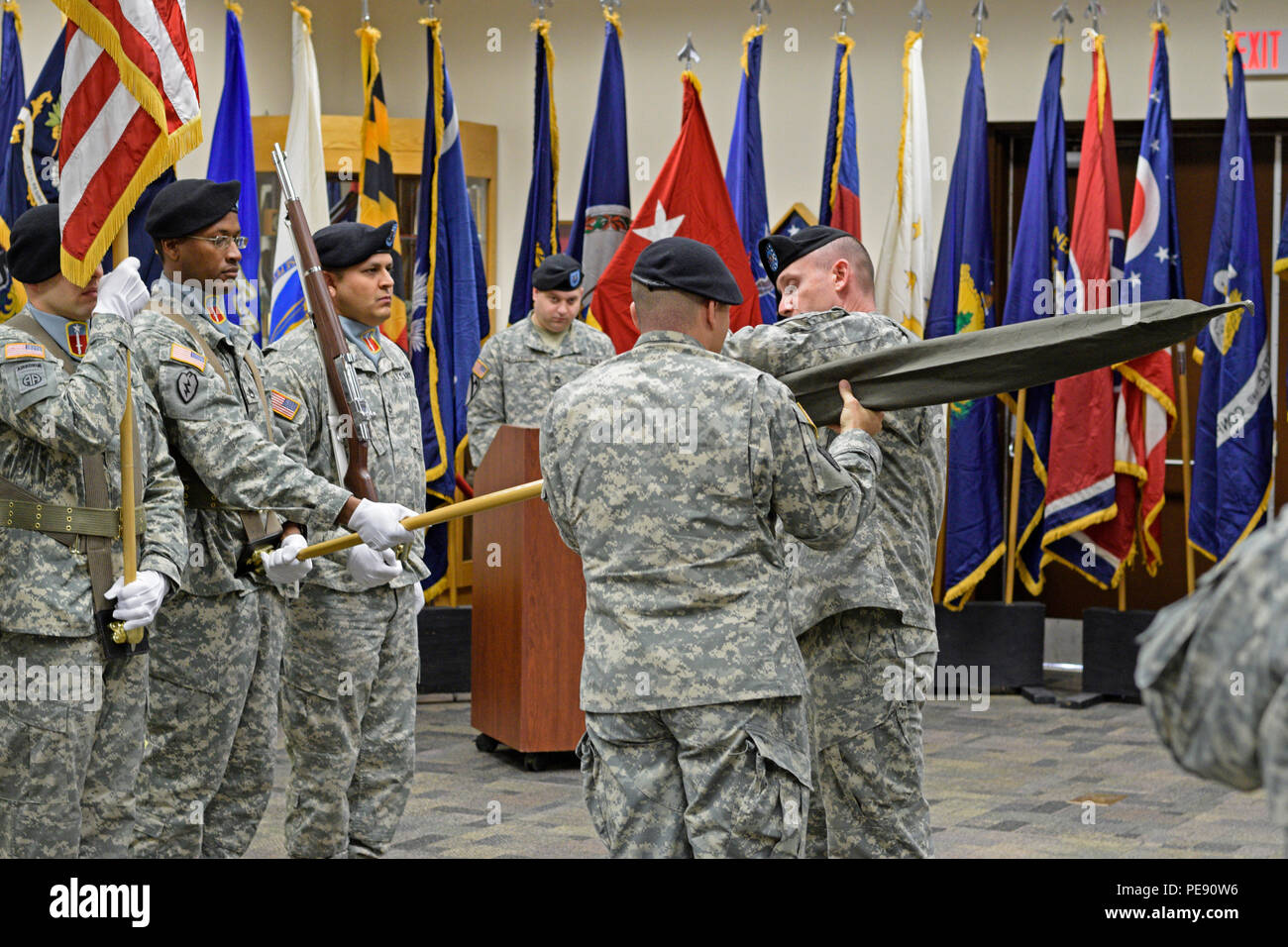 Command Sgt. Maj. Royce Manis, 205th Infantry Brigade, cases the unit ...