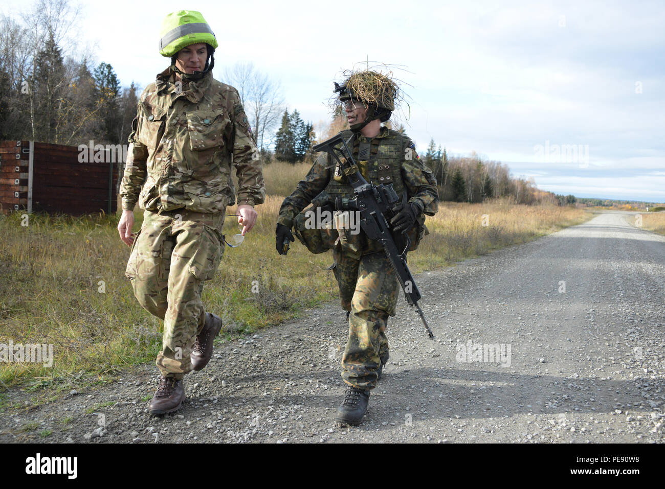 A German soldier (second from left), assigned to the Hammelburg ...