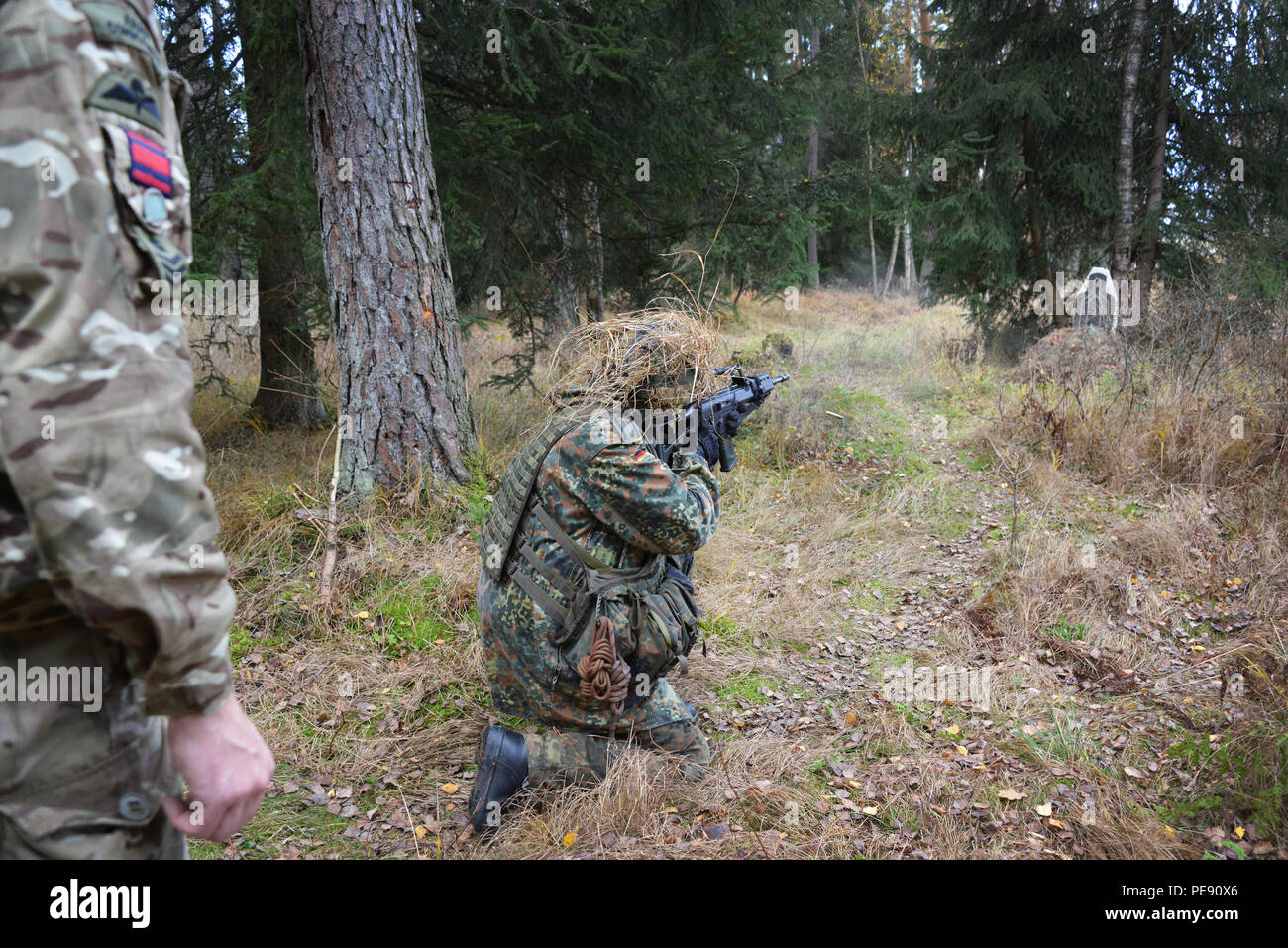 A German soldier (center), assigned to the Hammelburg Infantry Training ...