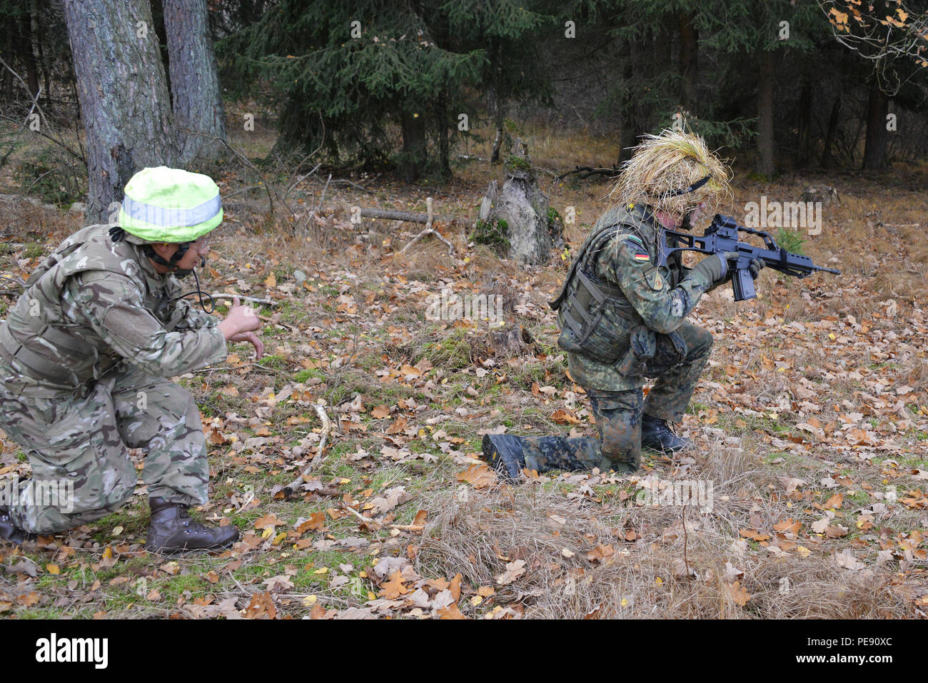 A German soldier (right), assigned to the Hammelburg Infantry Training ...
