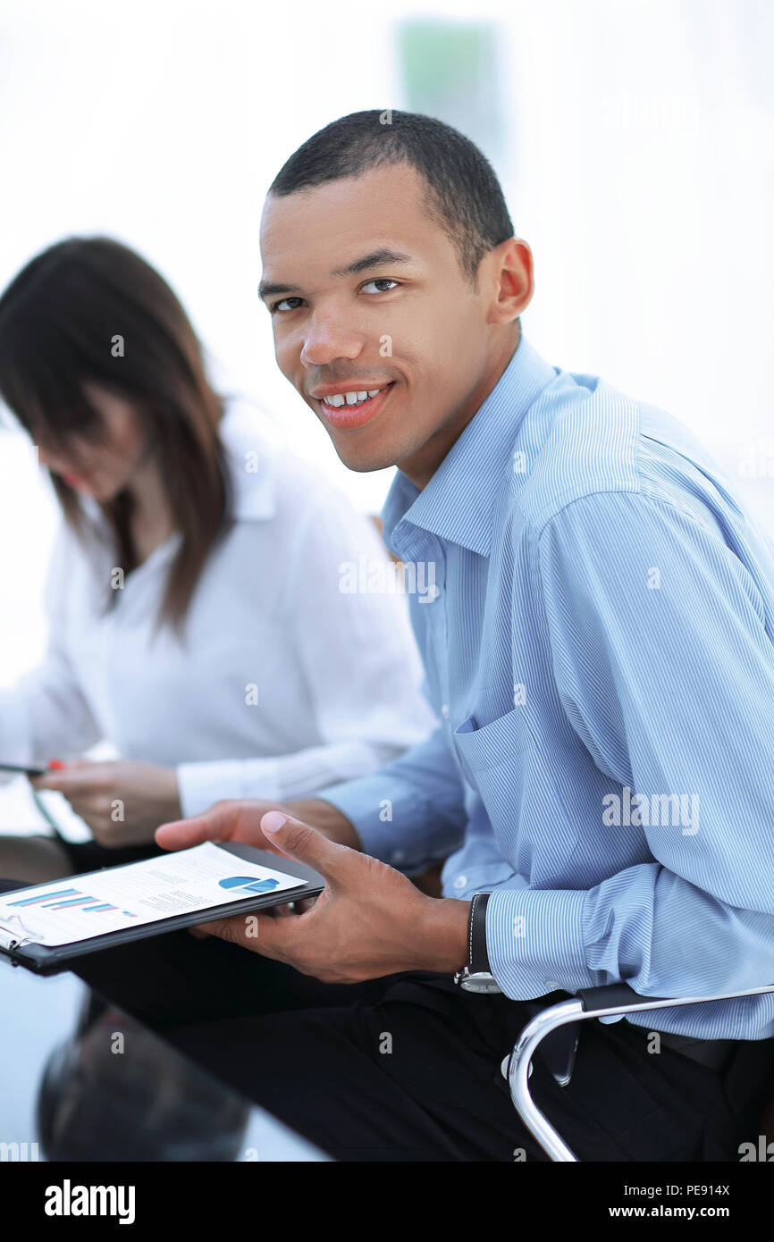 successful young business men with financial document Stock Photo - Alamy
