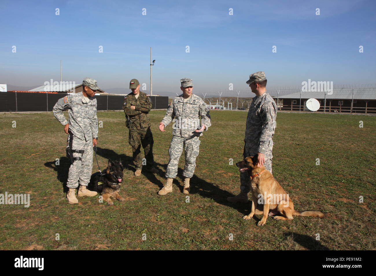U.S. Army military working dog handlers, Spc. David Desmond (left ...
