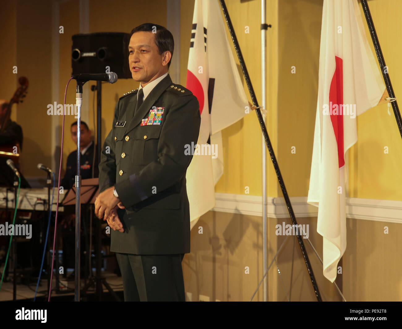 Japan Ground Self-Defense Force General Kiyofumi Iwata greets the bands ...