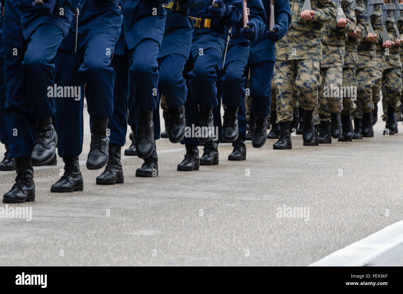 Soldiers marching on street during parade Stock Photo - Alamy