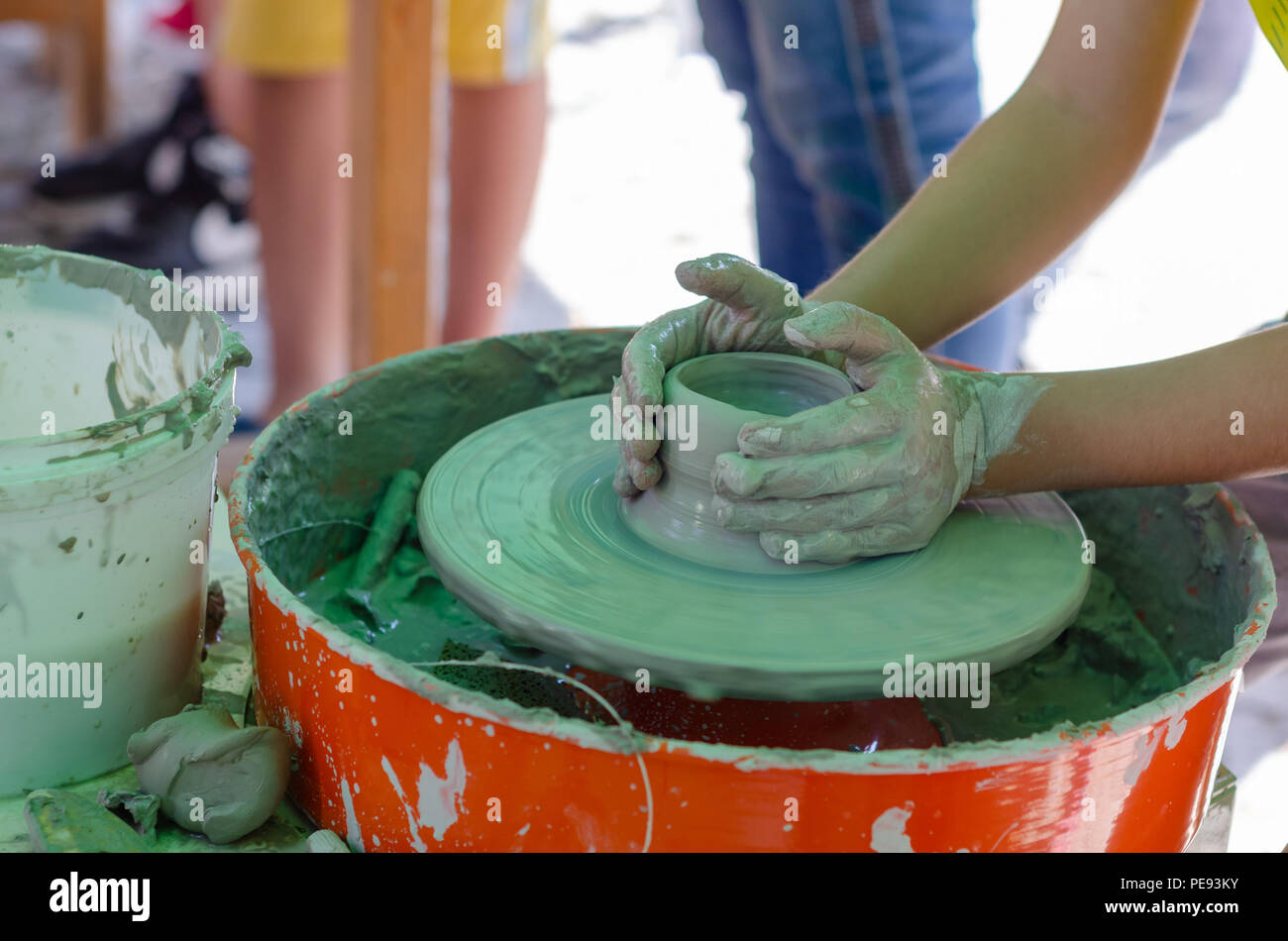 Hands working on pottery .Ceramic-making trial in ceramic workshops ...