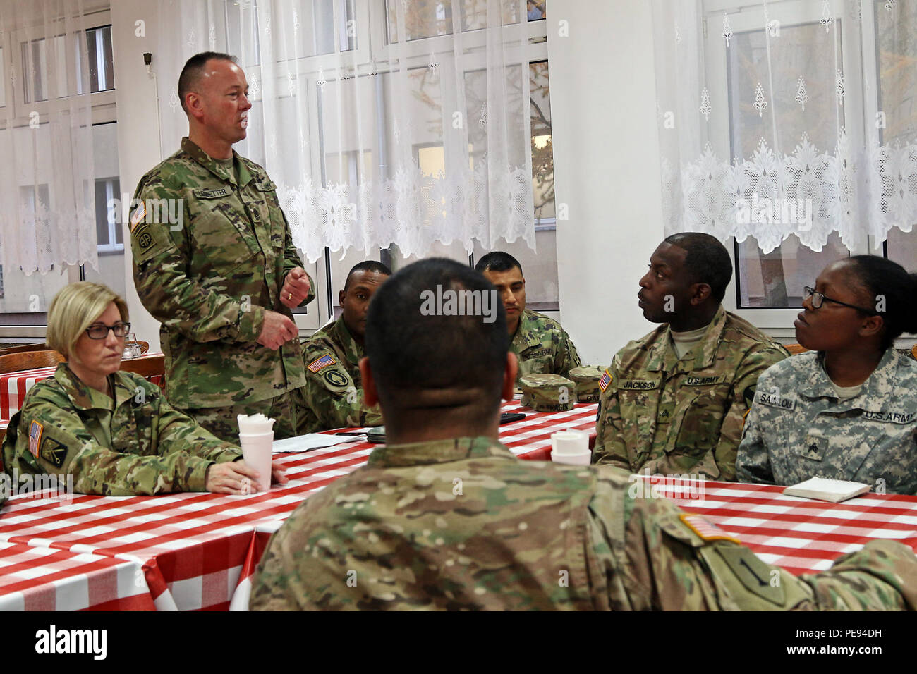 Command Sgt. Maj. Maveric Ledbetter (standing), the senior ...