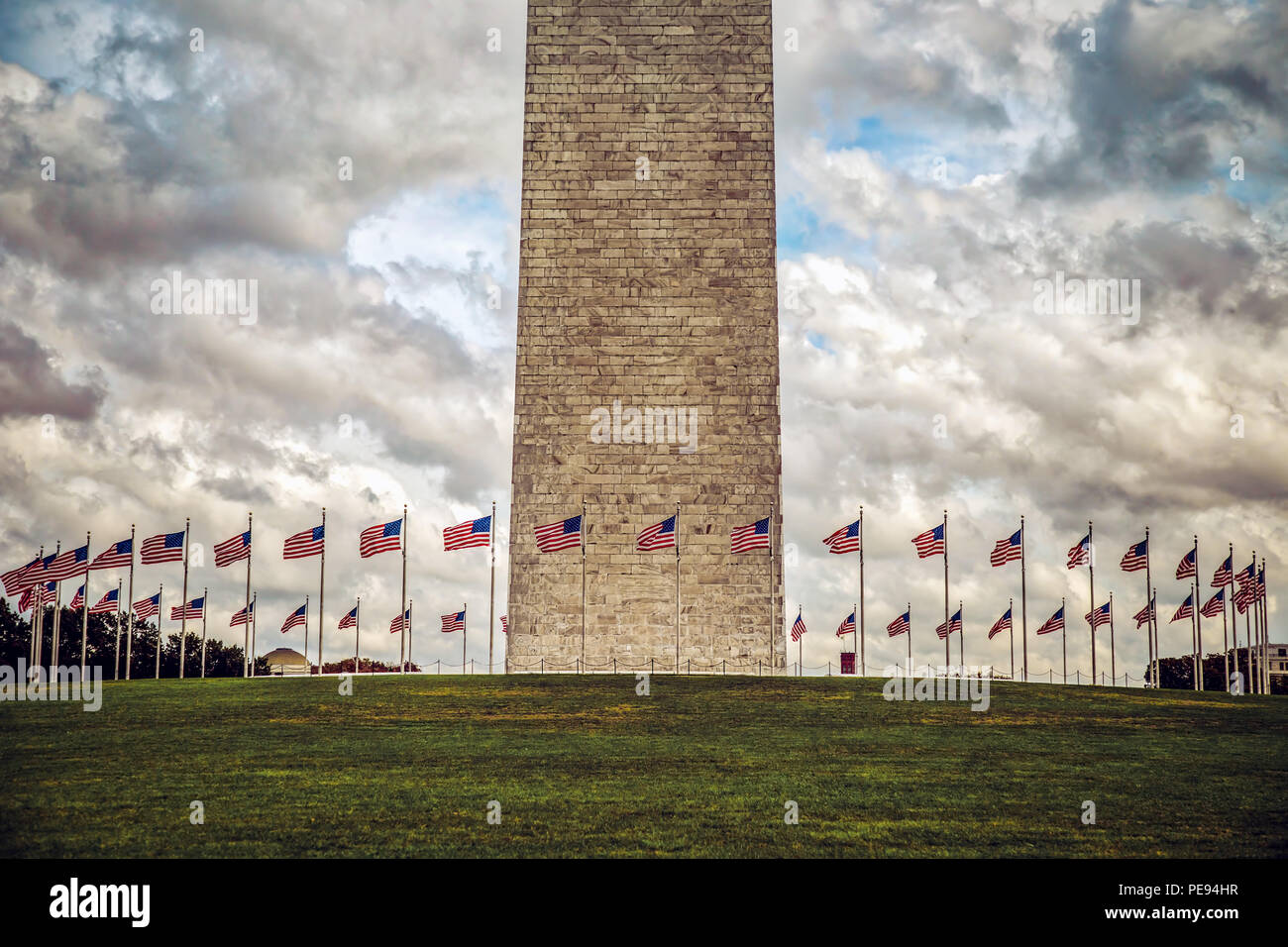 A circle of American flags at the base of the Washington Monument in ...