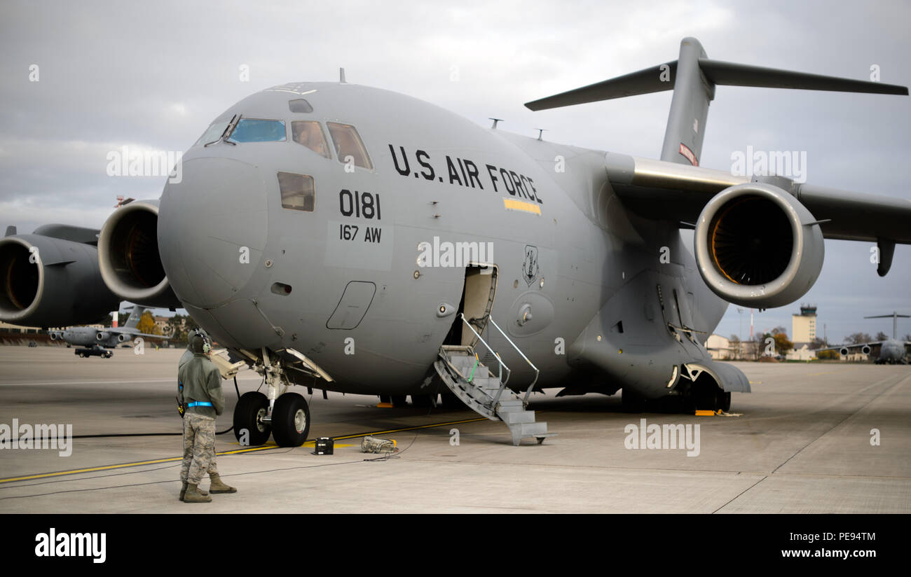 Crew chiefs from the 521st Air Mobility Operations Wing stand beside a ...