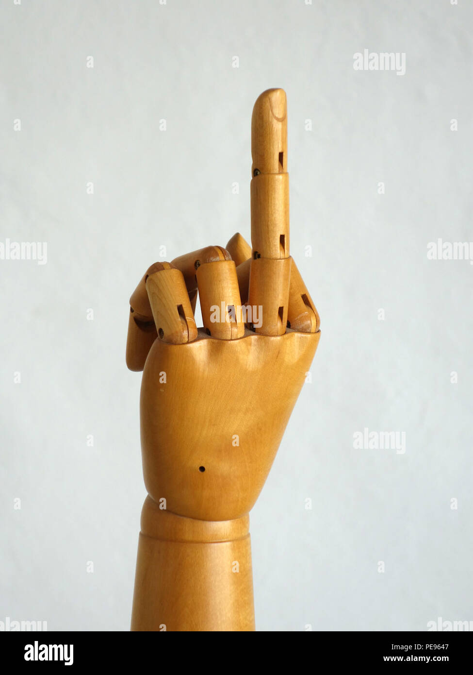 Wooden Hand Manikin making the finger gesture Stock Photo - Alamy