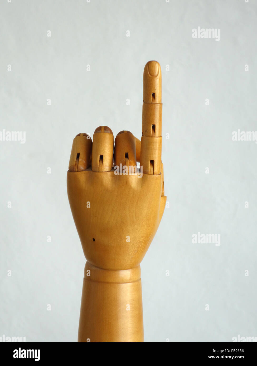 Wooden Hand Manikin making 1 finger gesture Stock Photo - Alamy