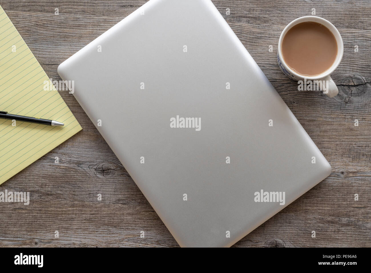 Office table notepad computer tea hi-res stock photography and images ...