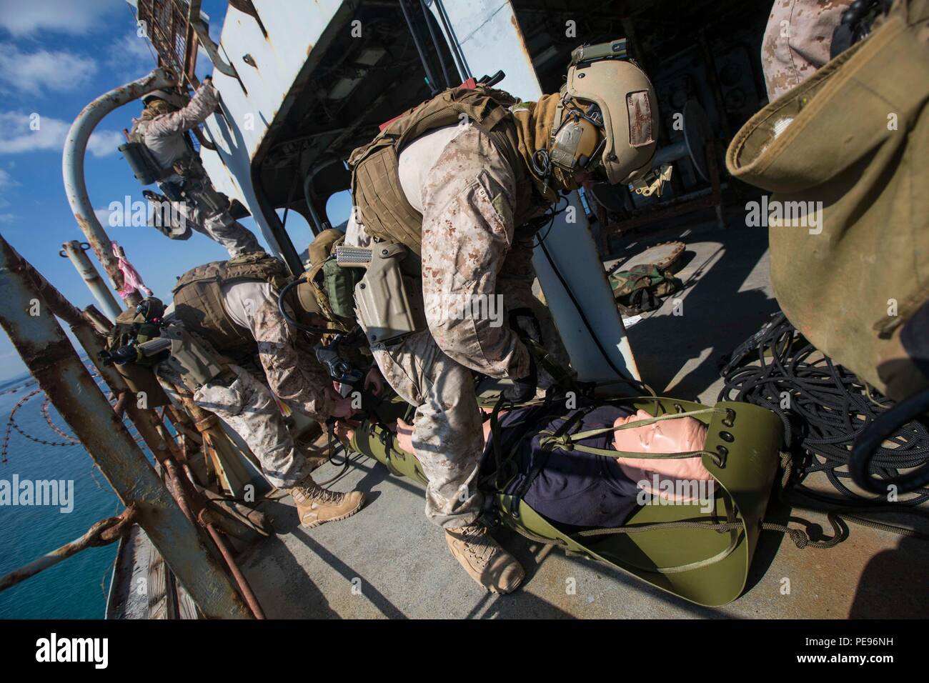 U.S. Marines and a Navy Special Amphibious Reconnaissance Corpsman ...