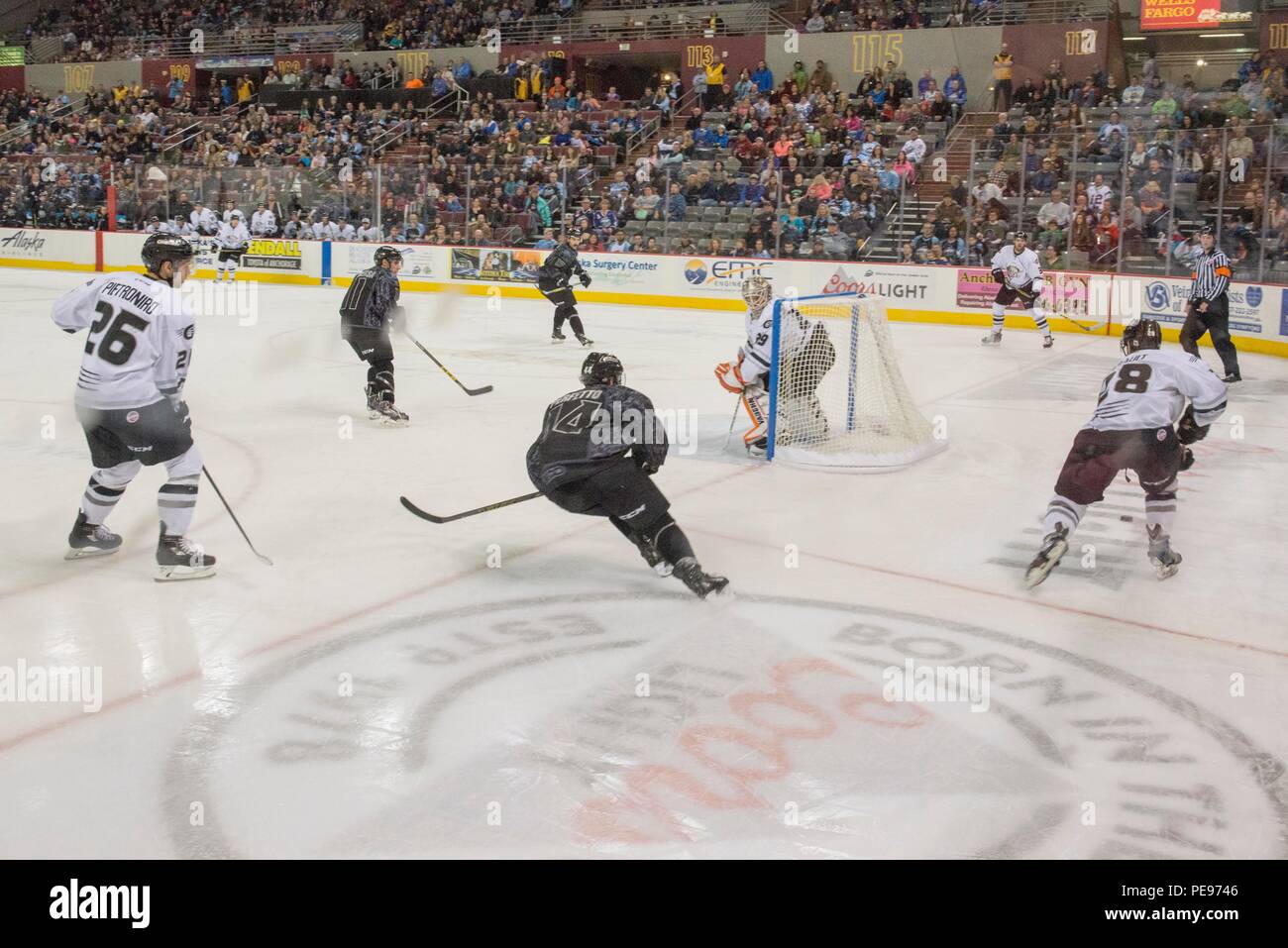The Alaska Aces try to regain the puck from the Utah Grizzles at the ...