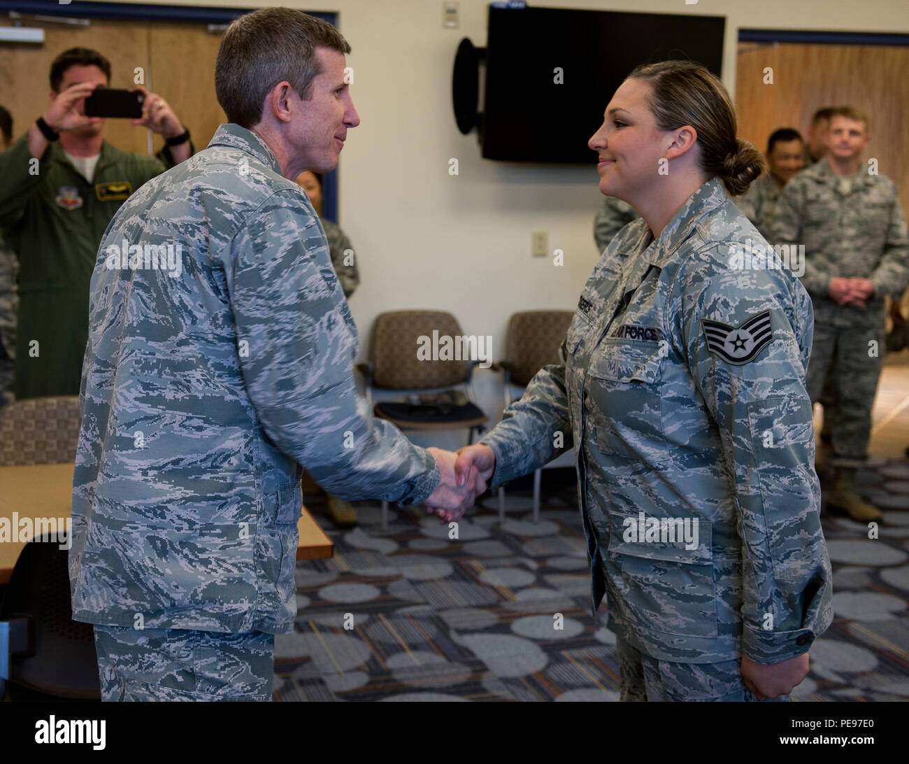 Col. Thomas Kunkel, 23rd Wing commander, coins Staff Sgt. Megan Rodgers ...