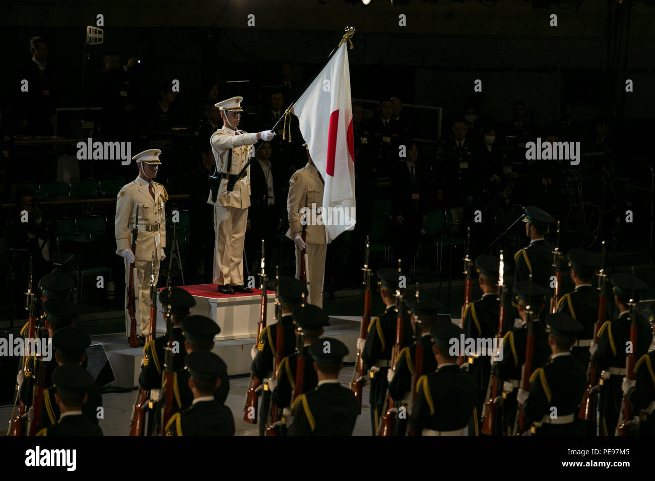 Japan Ground Self- Defense Force members present their nation’s flag as ...