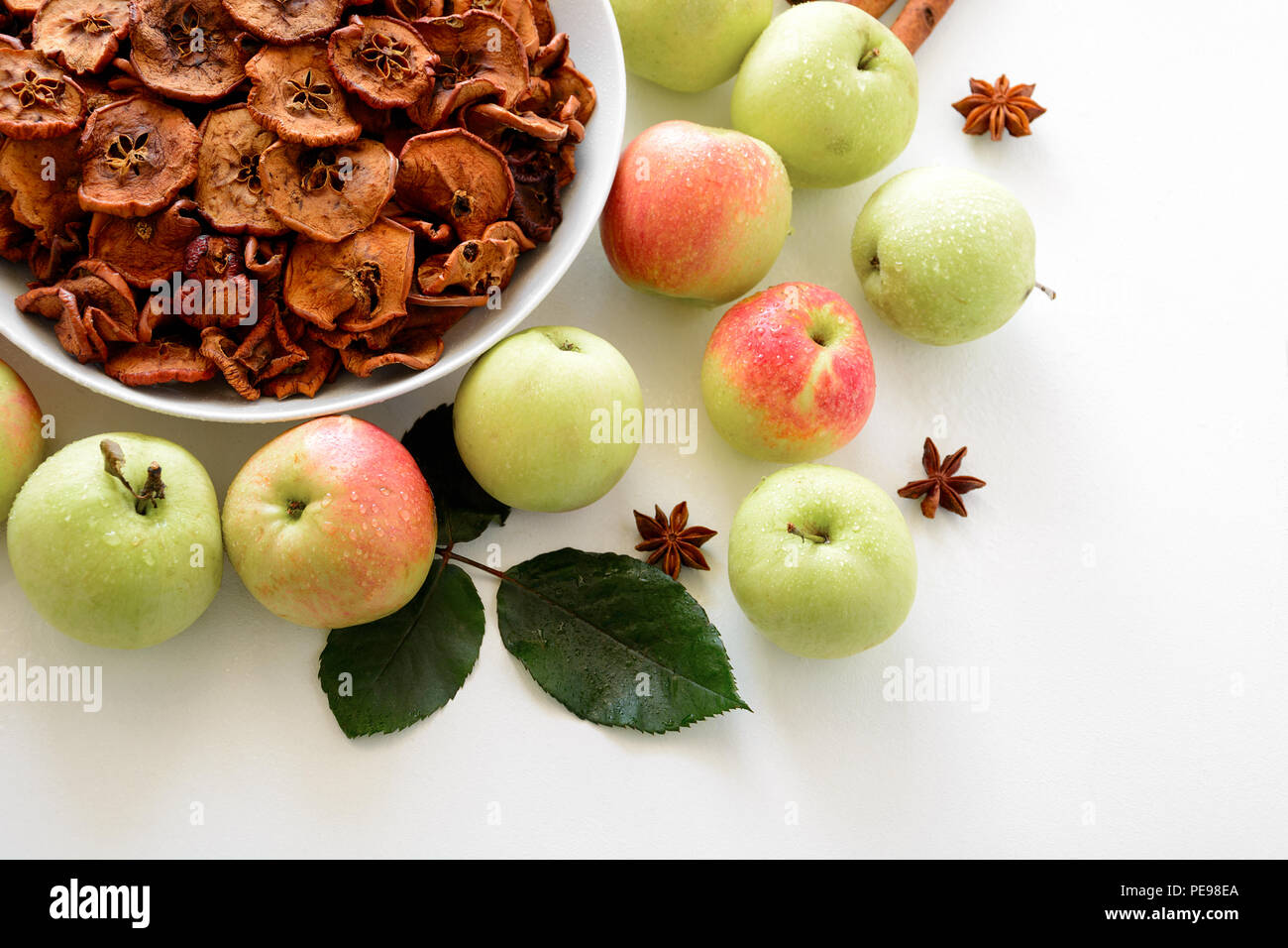 Homemade sun-dried organic apple slices (crispy apple chips) with fresh ...