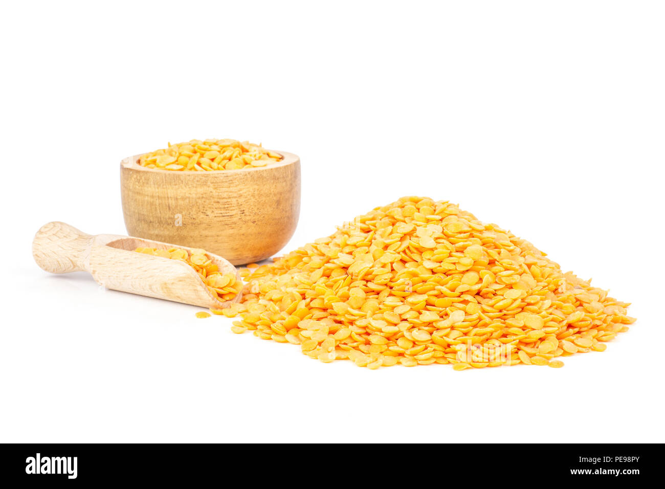 Lot of whole raw red lentils and scoop with wooden bowl isolated on ...