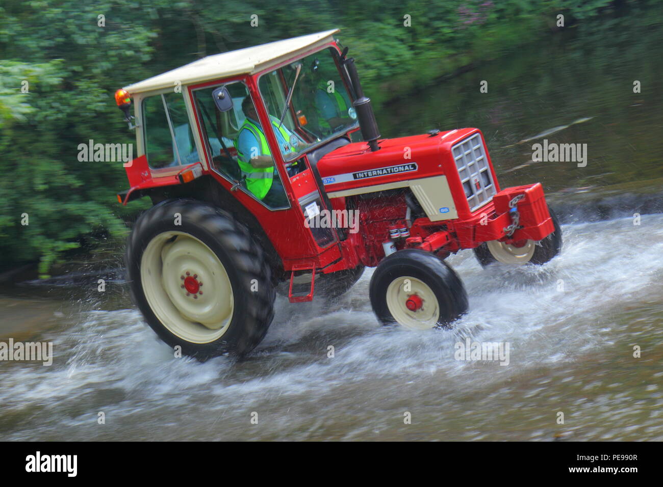 An International 574 tractor drives through the River Skell in Ripon ...