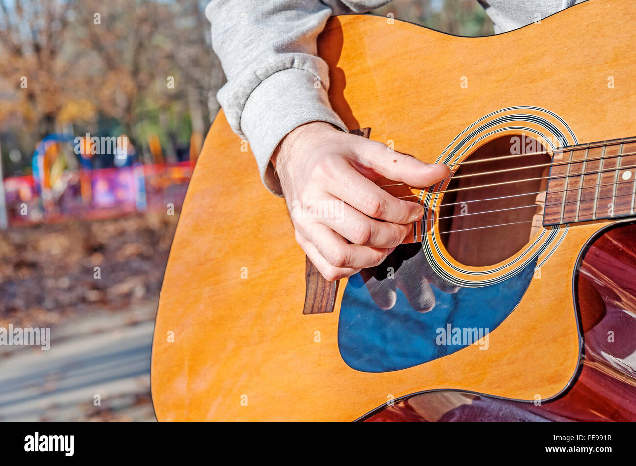 Guy playing guitar in nature hi-res stock photography and images - Alamy