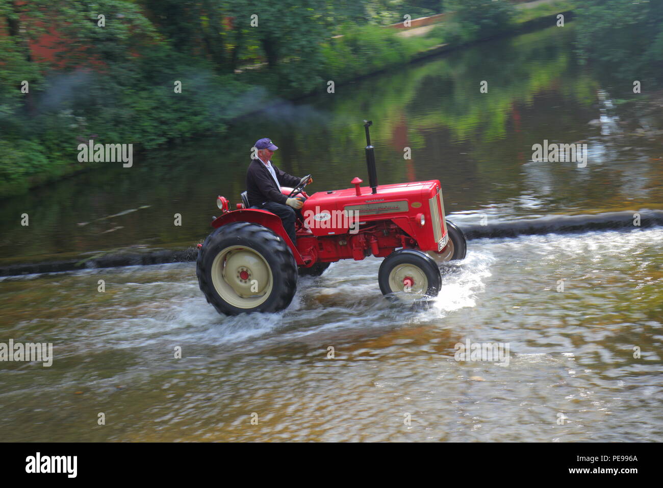 McCormick International B414 tractor crosses the River Skell in Ripon ...